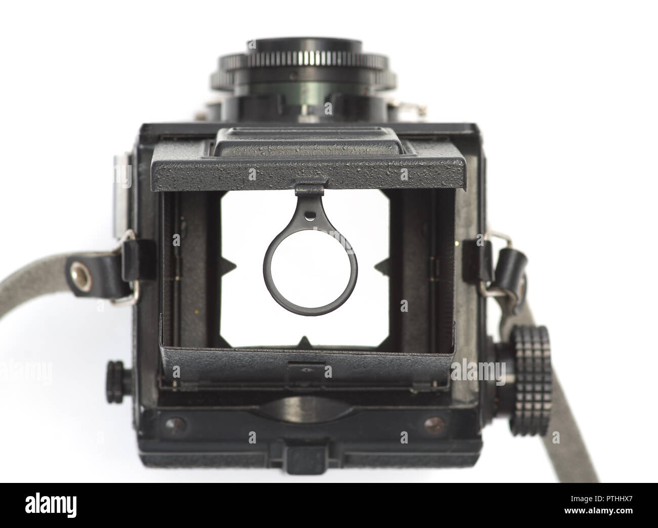 The viewfinder of an old, dual-lens reflex camera with a magnifying ...