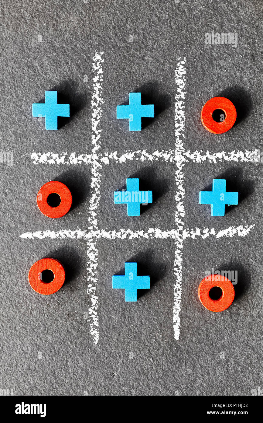 Close up picture of tic tac toe game (noughts and crosses) on dark ...
