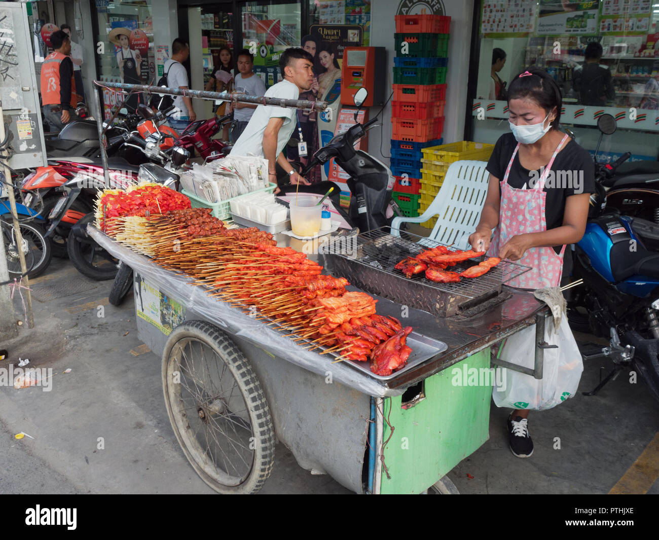 PATTAYA, THAILAND - MAY 25, 2018: Grilled chicken with stick on bbq ...