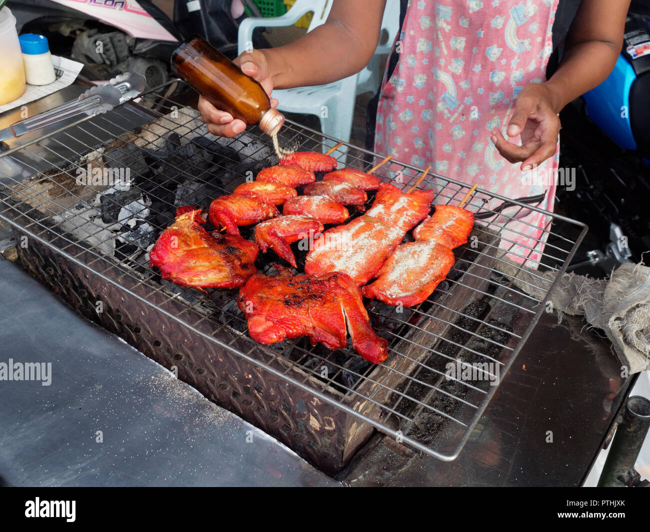PATTAYA, THAILAND - MAY 25, 2018: Grilled chicken with stick on bbq ...