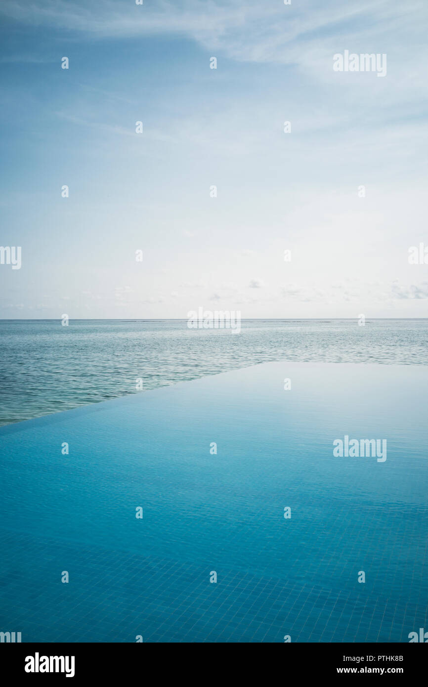Tranquil blue infinity pool and ocean, Maldives, Indian Ocean Stock ...