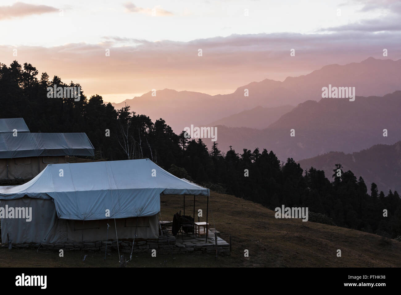 Yurts overlooking silhouetted mountains, Jaikuni, Indian Himalayan ...