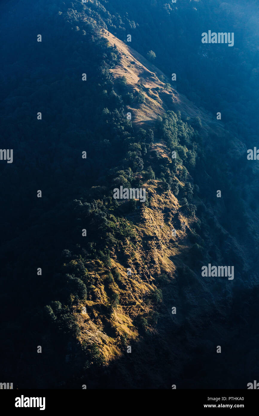 Sunshine and shadows over mountain, Supi Bageshwar, Uttarakhand, Indian ...