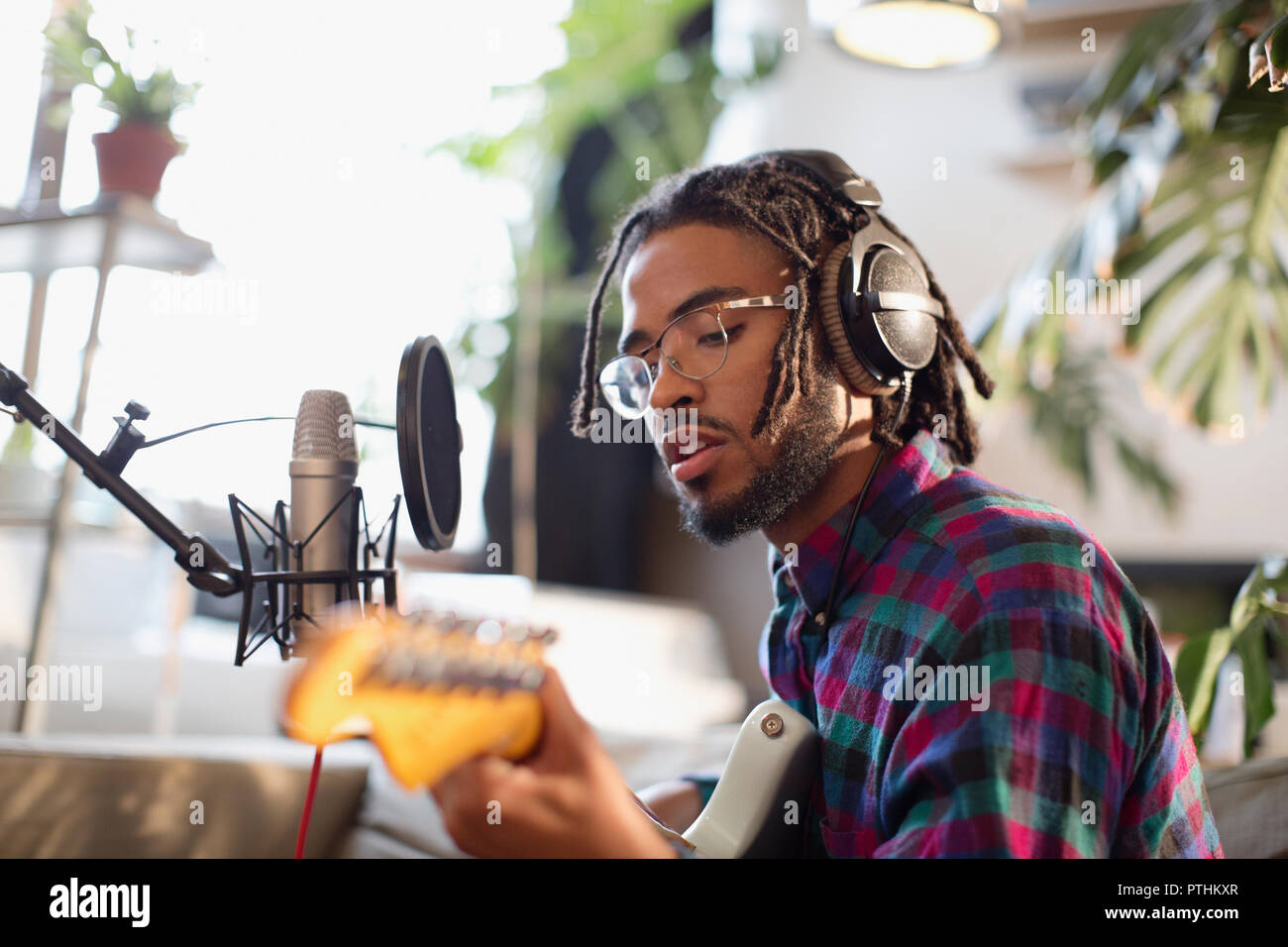 Serious black man holding microphone hi-res stock photography and ...