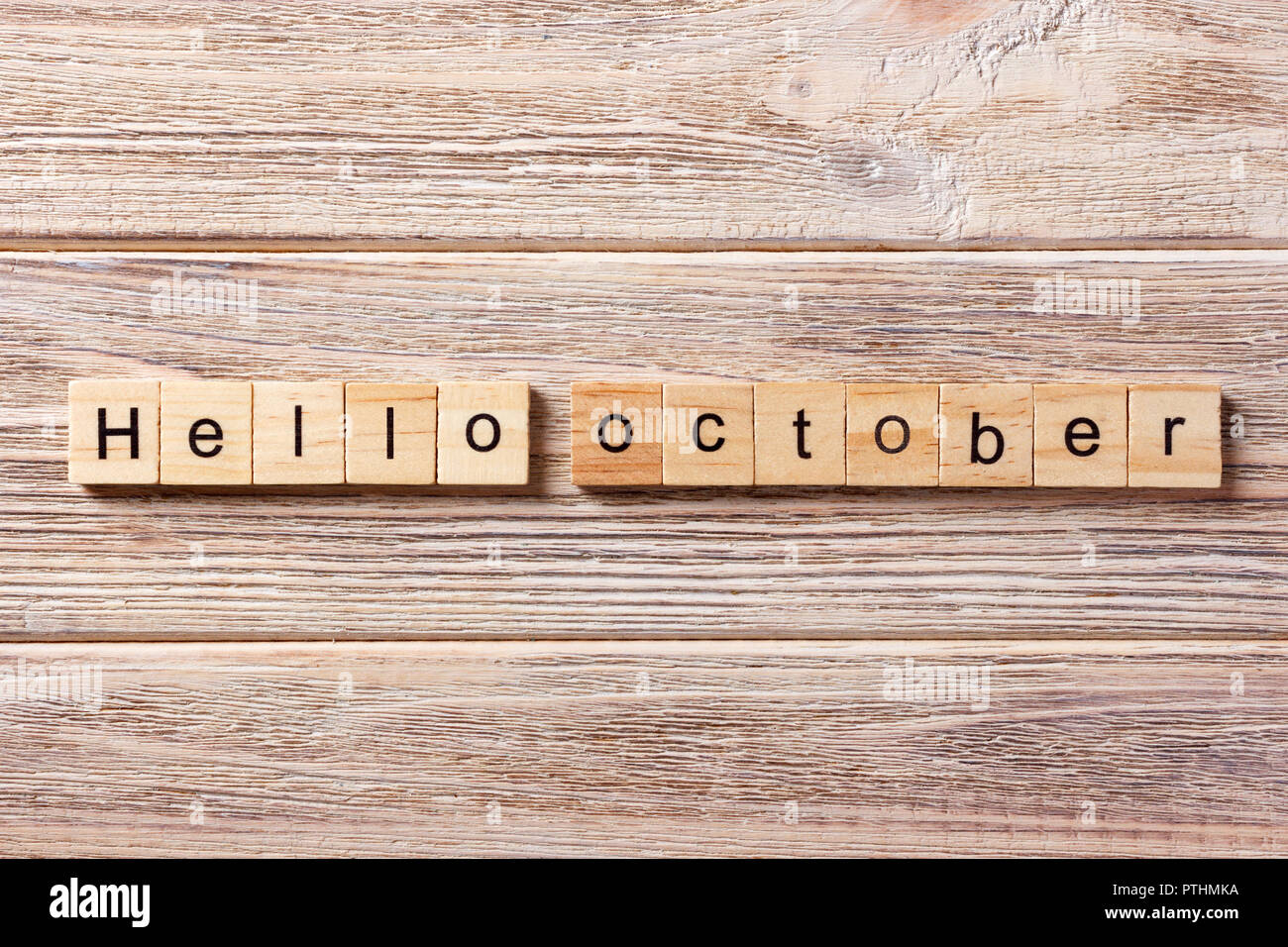 Hello October word written on wood block. Hello October text on table ...