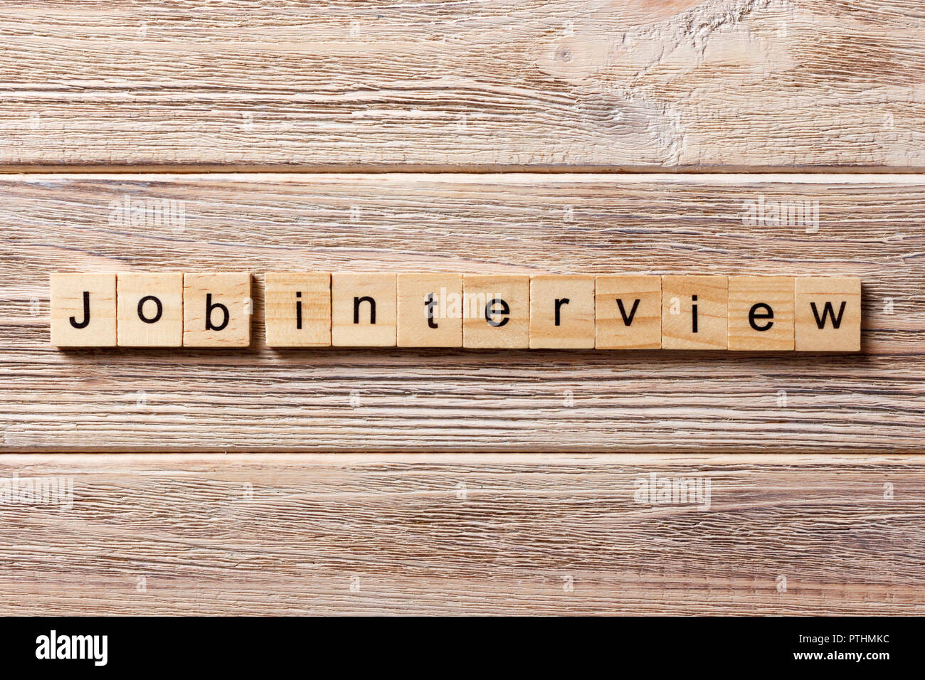 Job Interview word written on wood block. Job Interview text on table ...