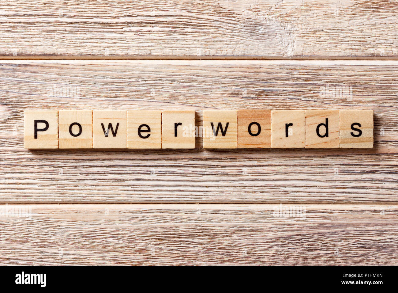 POWER WORDS word written on wood block. POWER WORDS text on table ...
