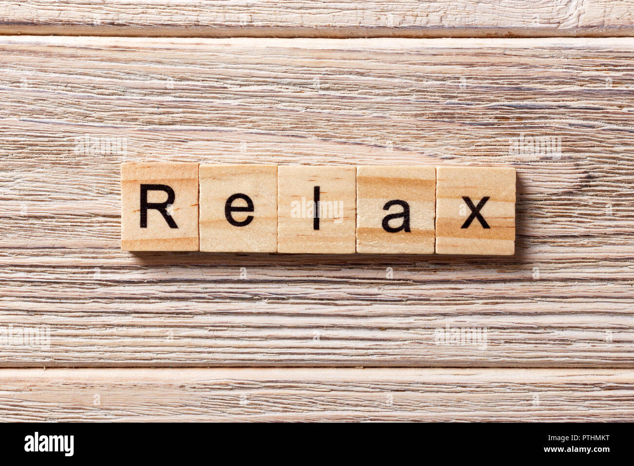 RELAX word written on wood block. RELAX text on table, concept Stock ...