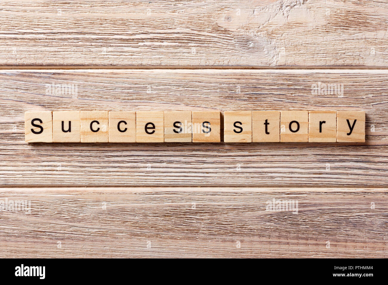 Success story word written on wood block. Success story text on table ...