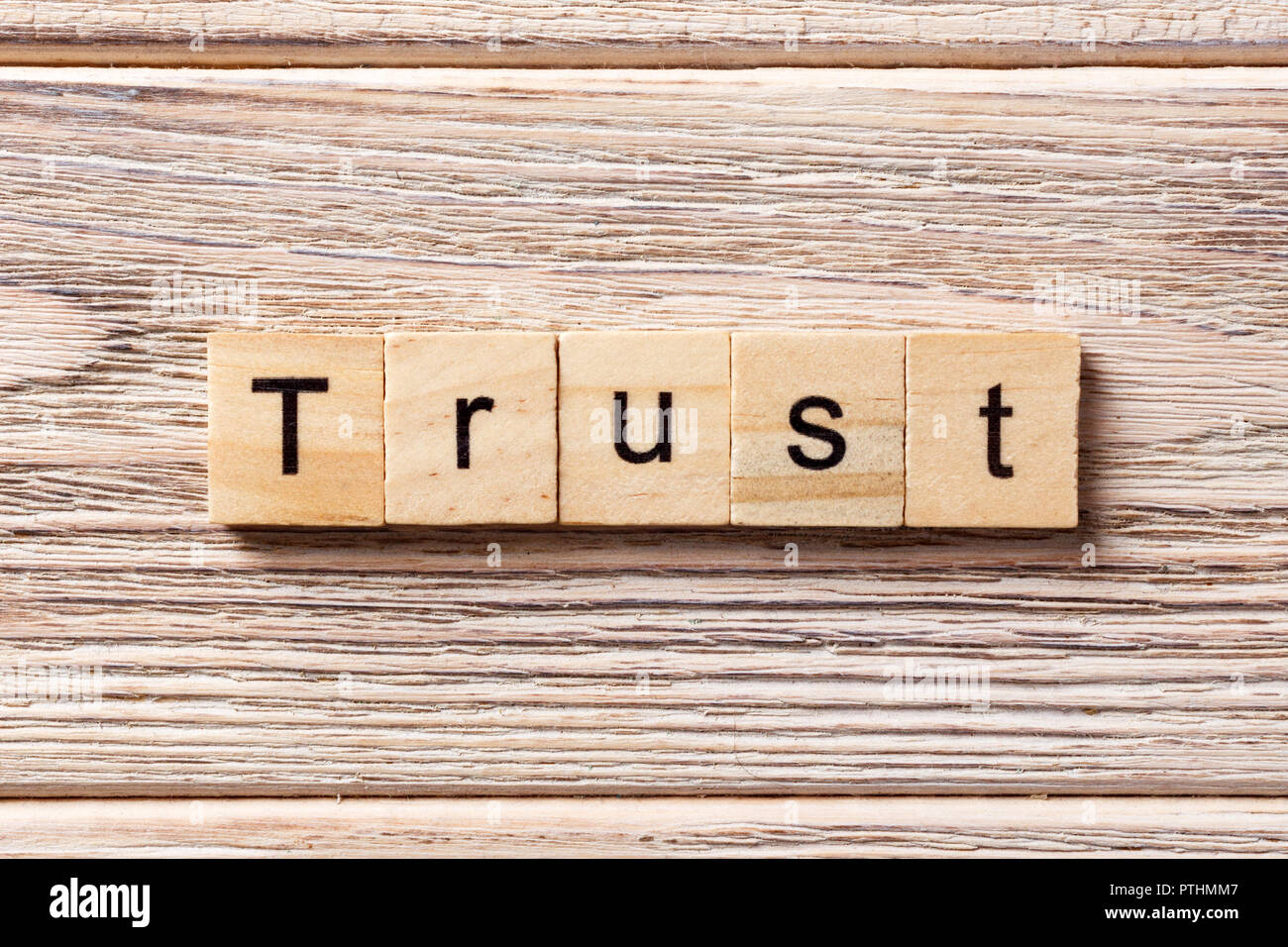 TRUST word written on wood block. TRUST text on table, concept Stock ...