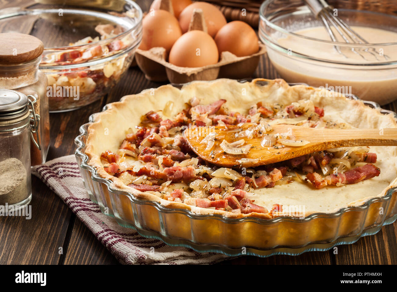 Making stuffing while preparing a traditional quiche. French cuisine ...