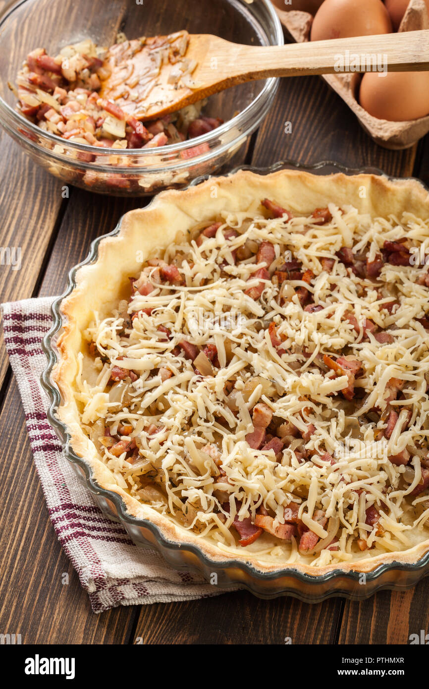 Making stuffing while preparing a traditional quiche. French cuisine ...