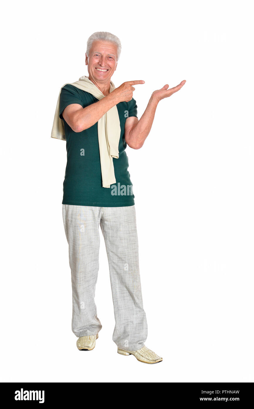 Portrait of senior man showing something isolated on white background ...