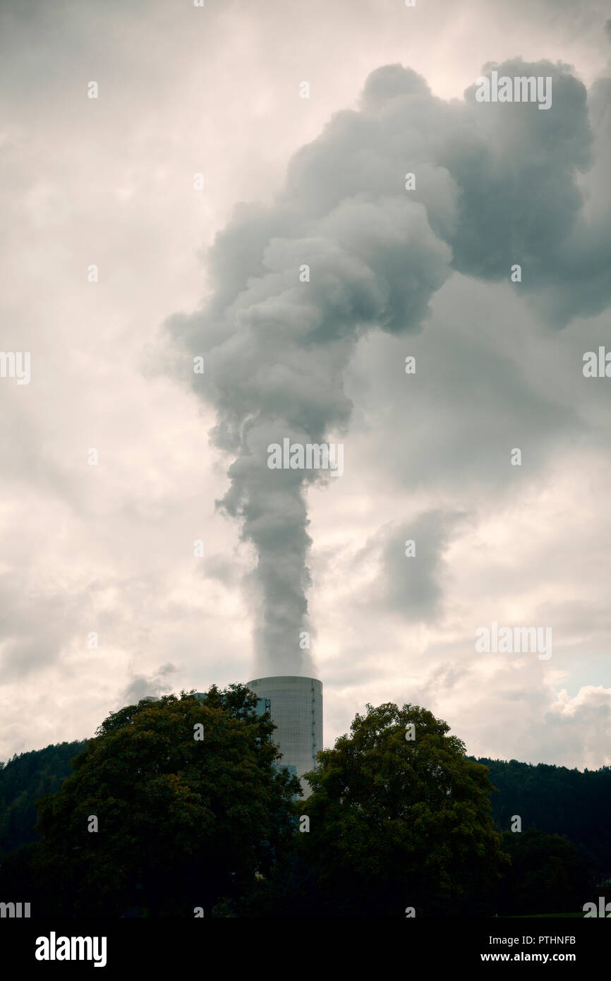 black smoke rising in the sky, environmental pollution Stock Photo - Alamy