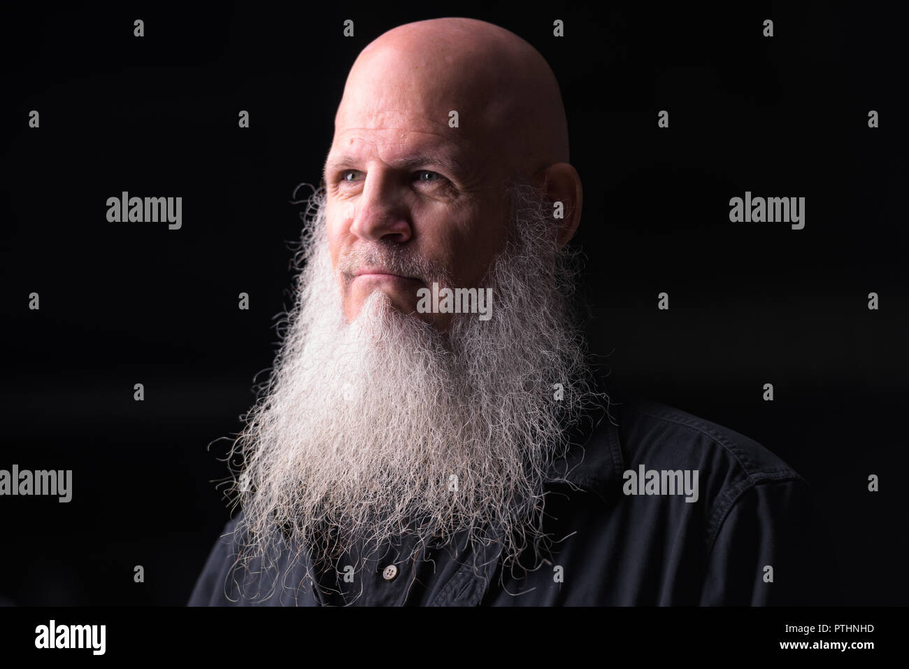 Portrait Of Bald Man With Gray Beard Thinking Outdoors At Night Stock ...