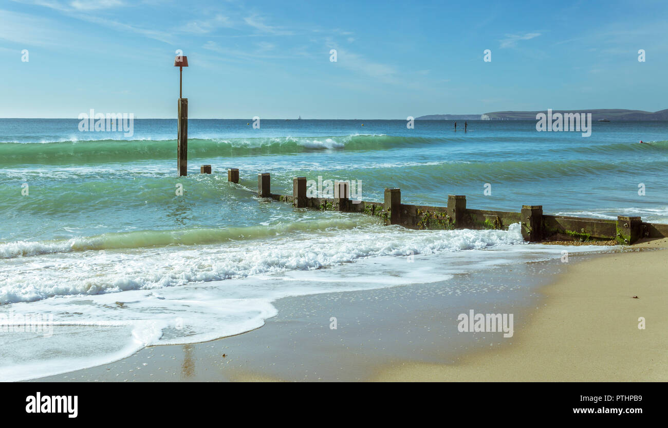 The waves wash over the Groynes at Boscombe in Bournemouth, UK. Taken ...