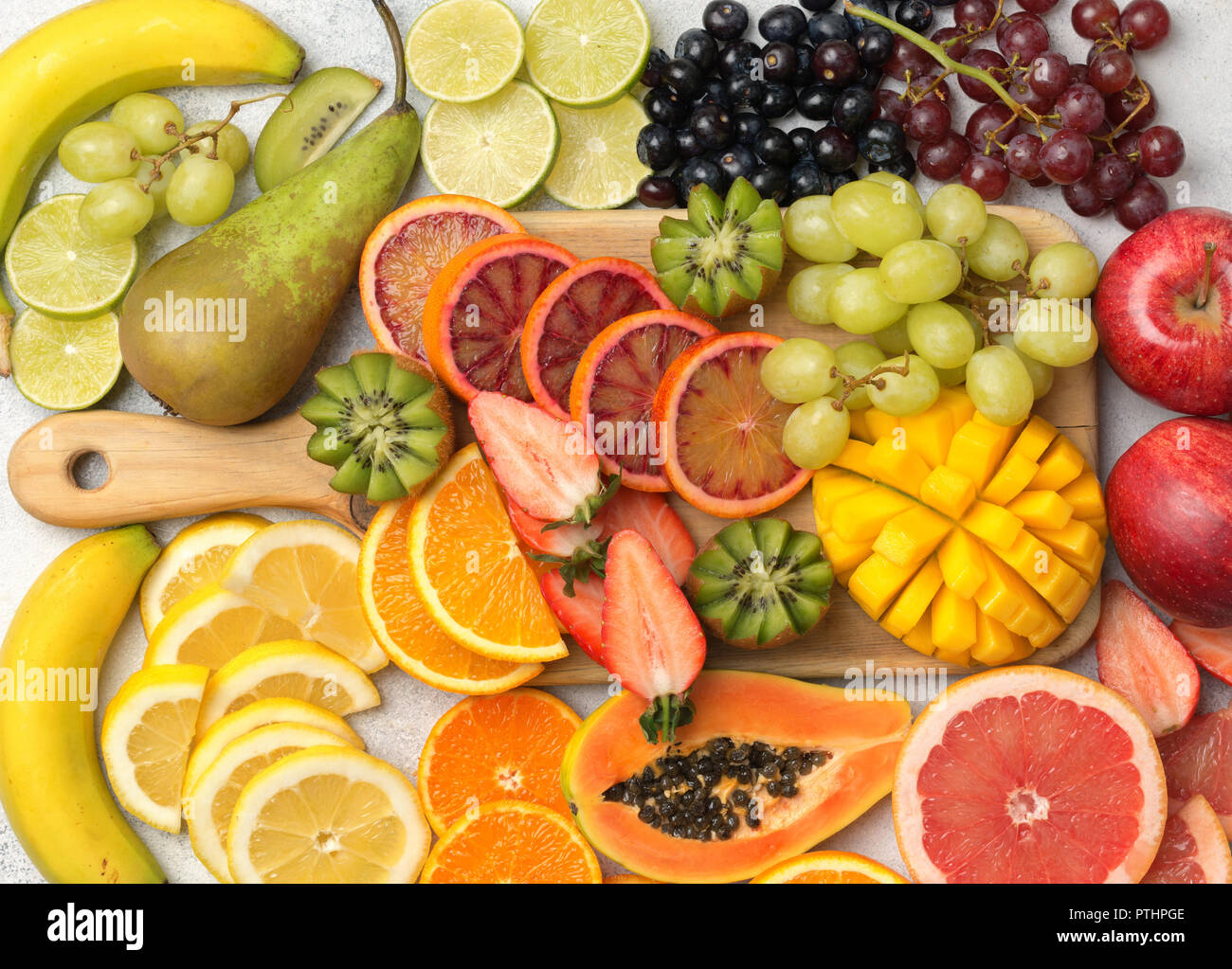 Healthy colourful fruits in rainbow colours, strawberries, mango ...
