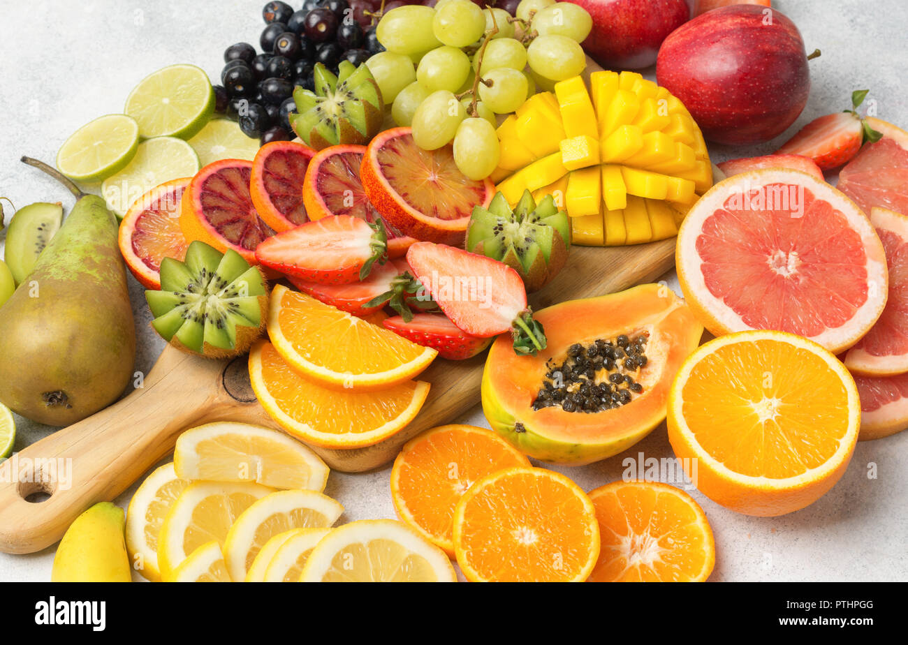 Healthy colourful fruits in rainbow colours, strawberries, mango ...