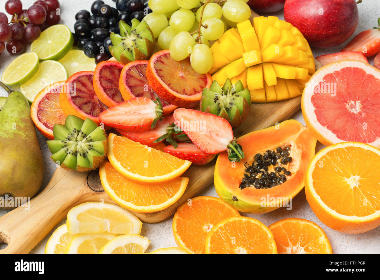 Healthy colourful fruits in rainbow colours, strawberries, mango ...