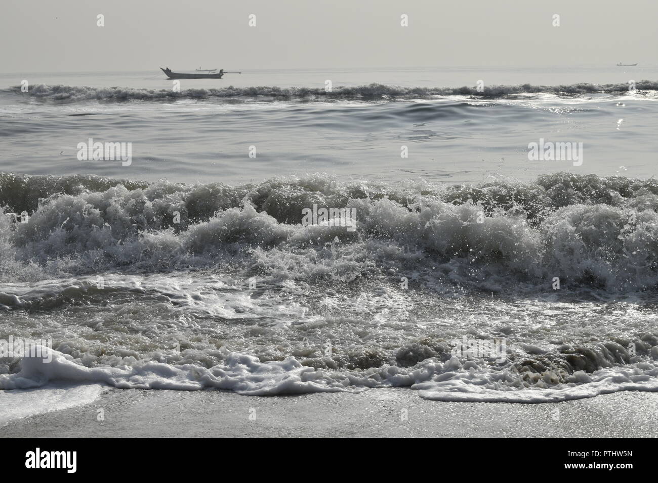 waves and boat Stock Photo - Alamy