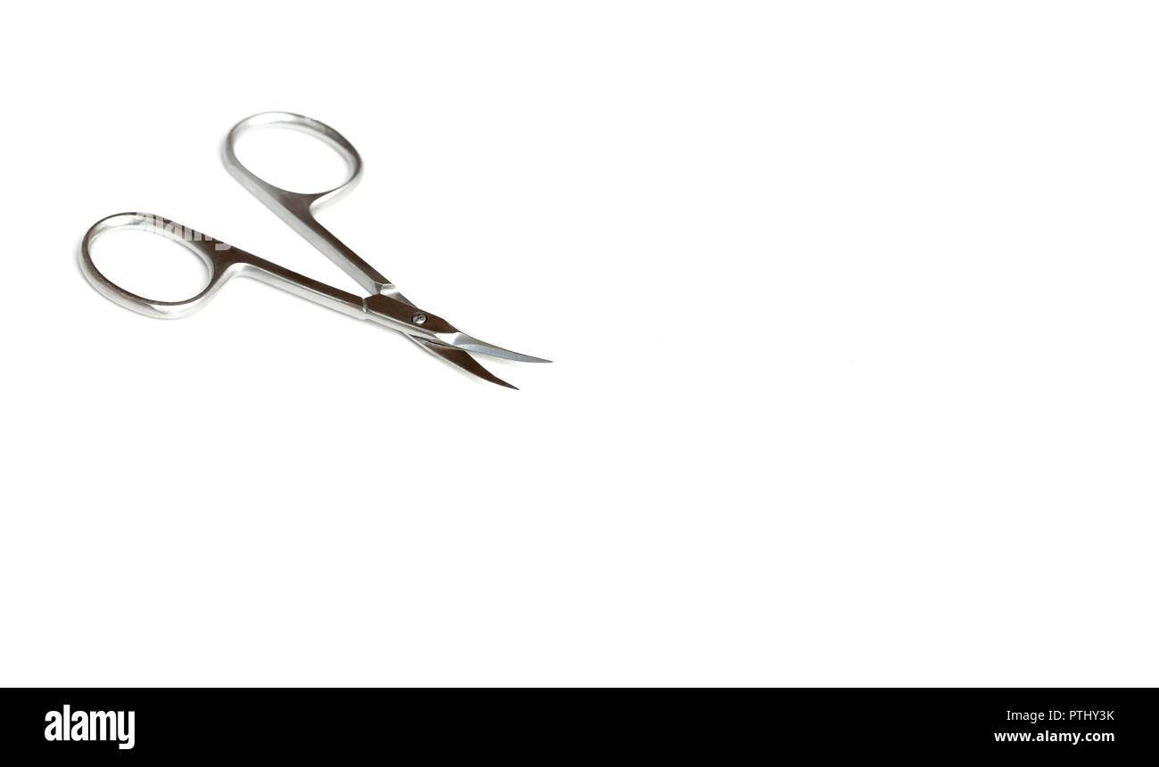 Small nail scissors are on a white background Stock Photo - Alamy