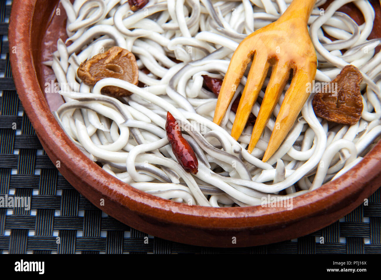 elvers cooked with garlic and pepper Stock Photo - Alamy