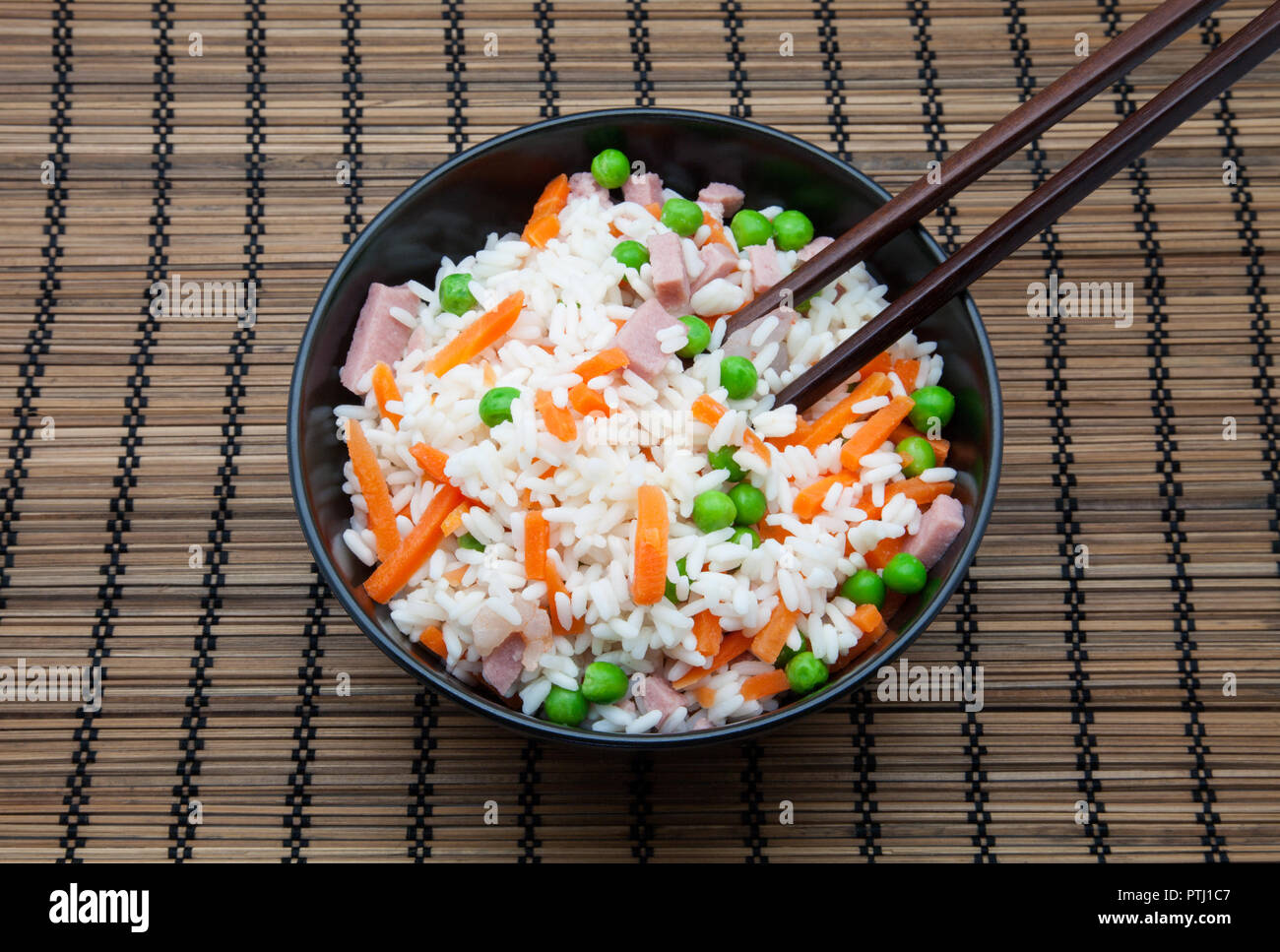 bowl of oriental typical fried rice Stock Photo - Alamy