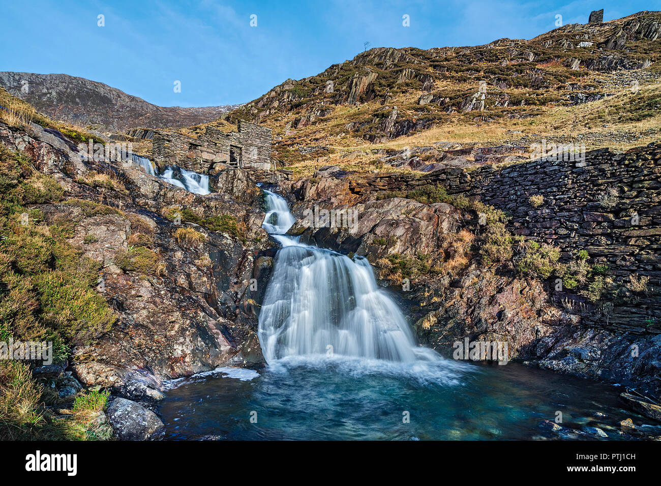 Waterfalls on Afon (River) Cwm Llan and an old slate quarry building ...