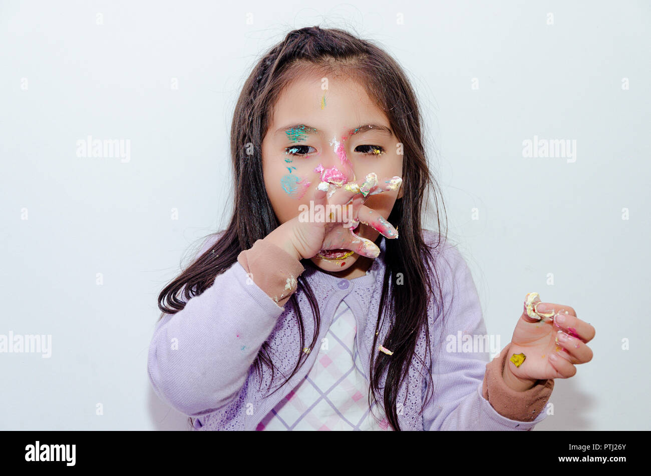Cute little girl smeared with cake on her face for her birthday Stock ...