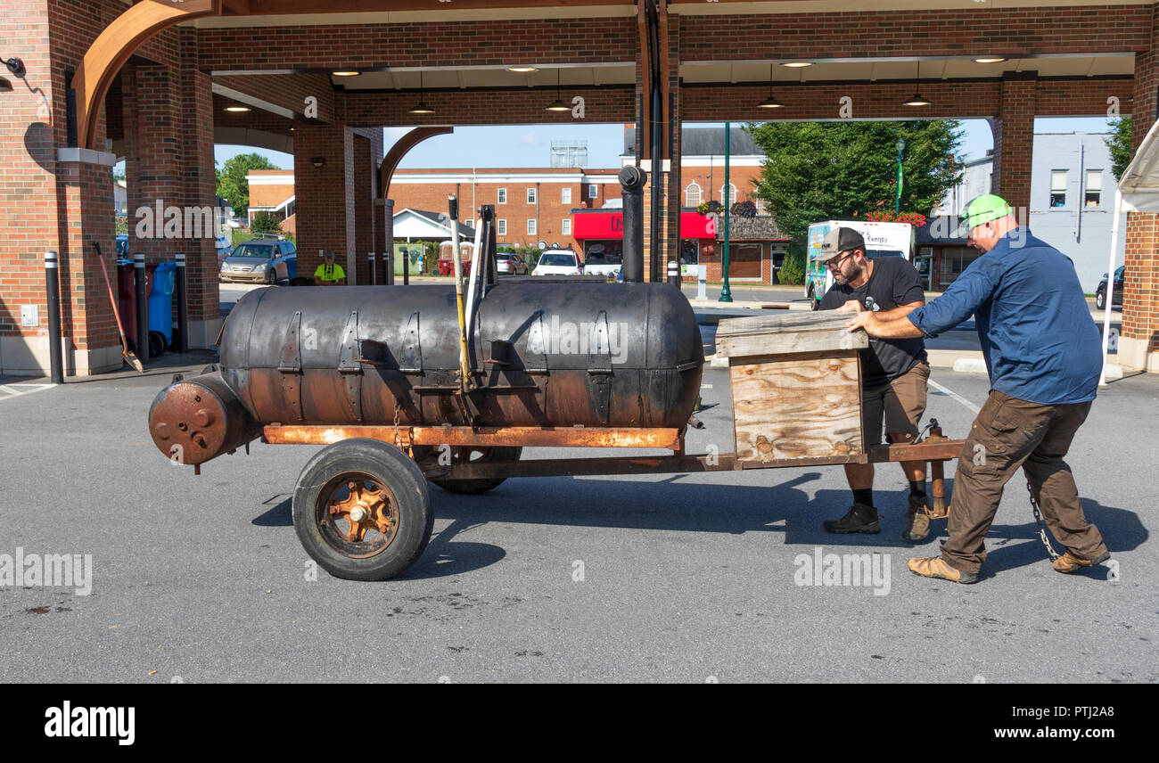 JOHNSON CITY, TN, USA-9/30/18: Two men prepare to hitch up a smoker ...