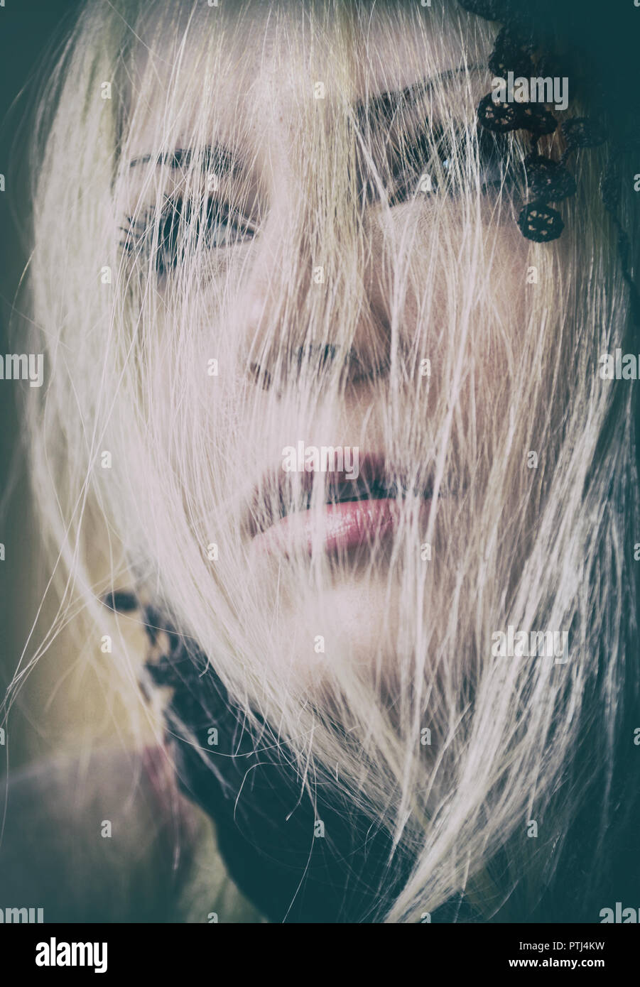 Beautiful young blond woman, pensive facial expression Stock Photo - Alamy