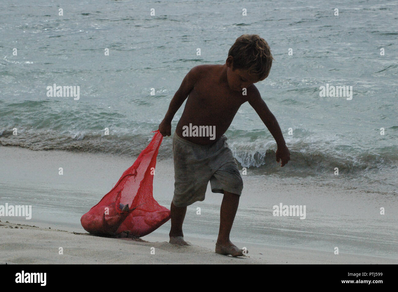 Child fishing labour hi-res stock photography and images - Alamy