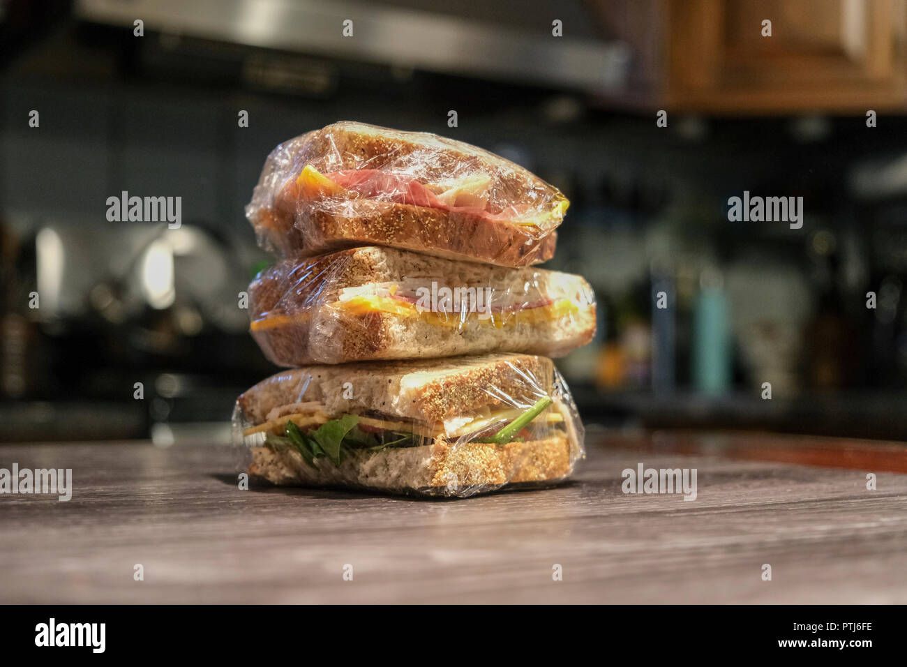 stacked sandwich halves on kitchen counter Stock Photo - Alamy