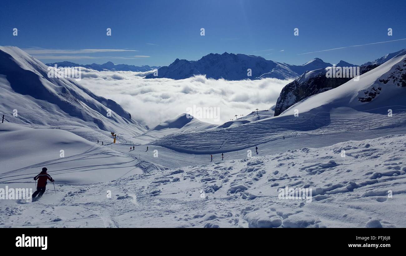 Image of ski resort with slopes in the mountains with low stratus over ...