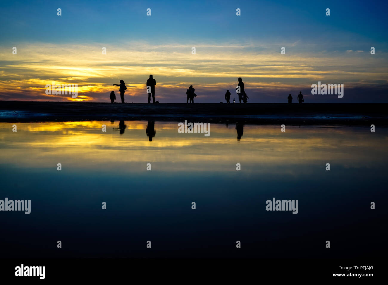 Human figures on a beach in San Francisco Stock Photo - Alamy