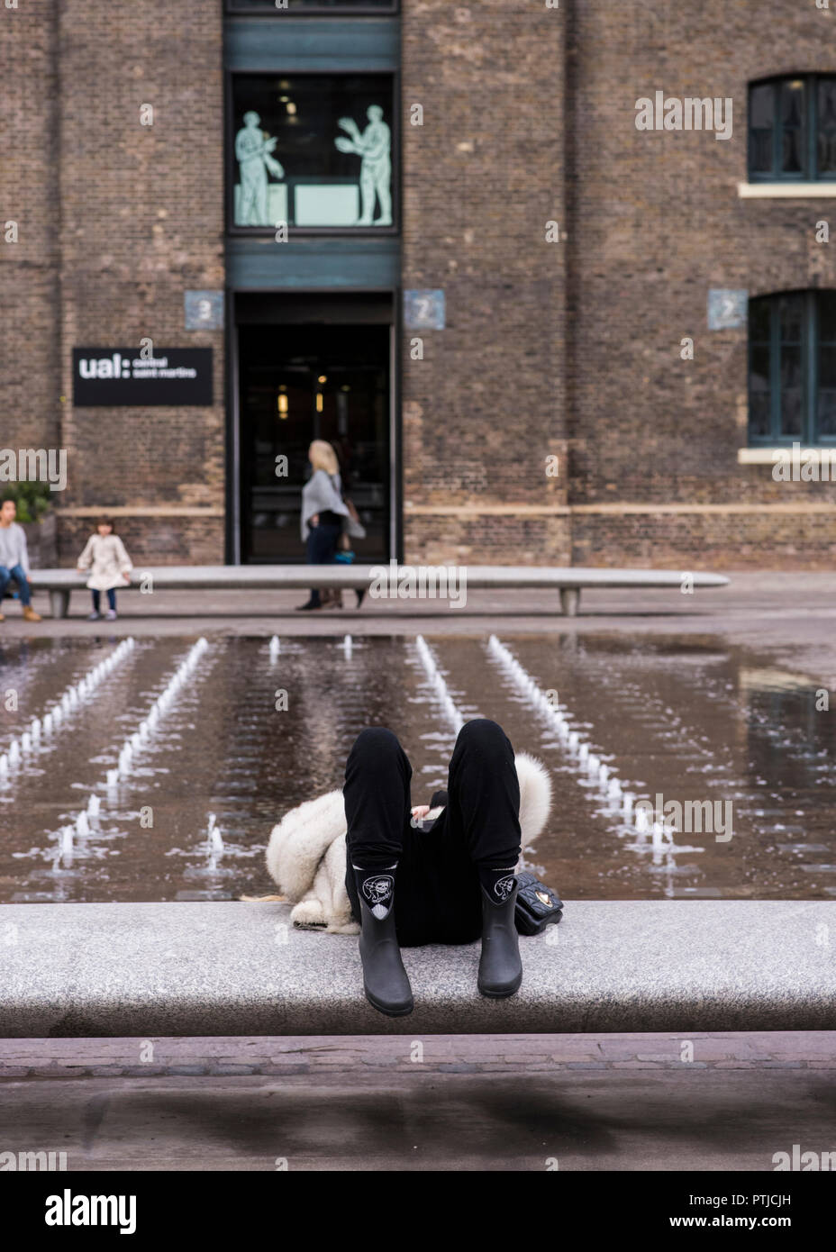 Female lying down on bench hi-res stock photography and images - Alamy