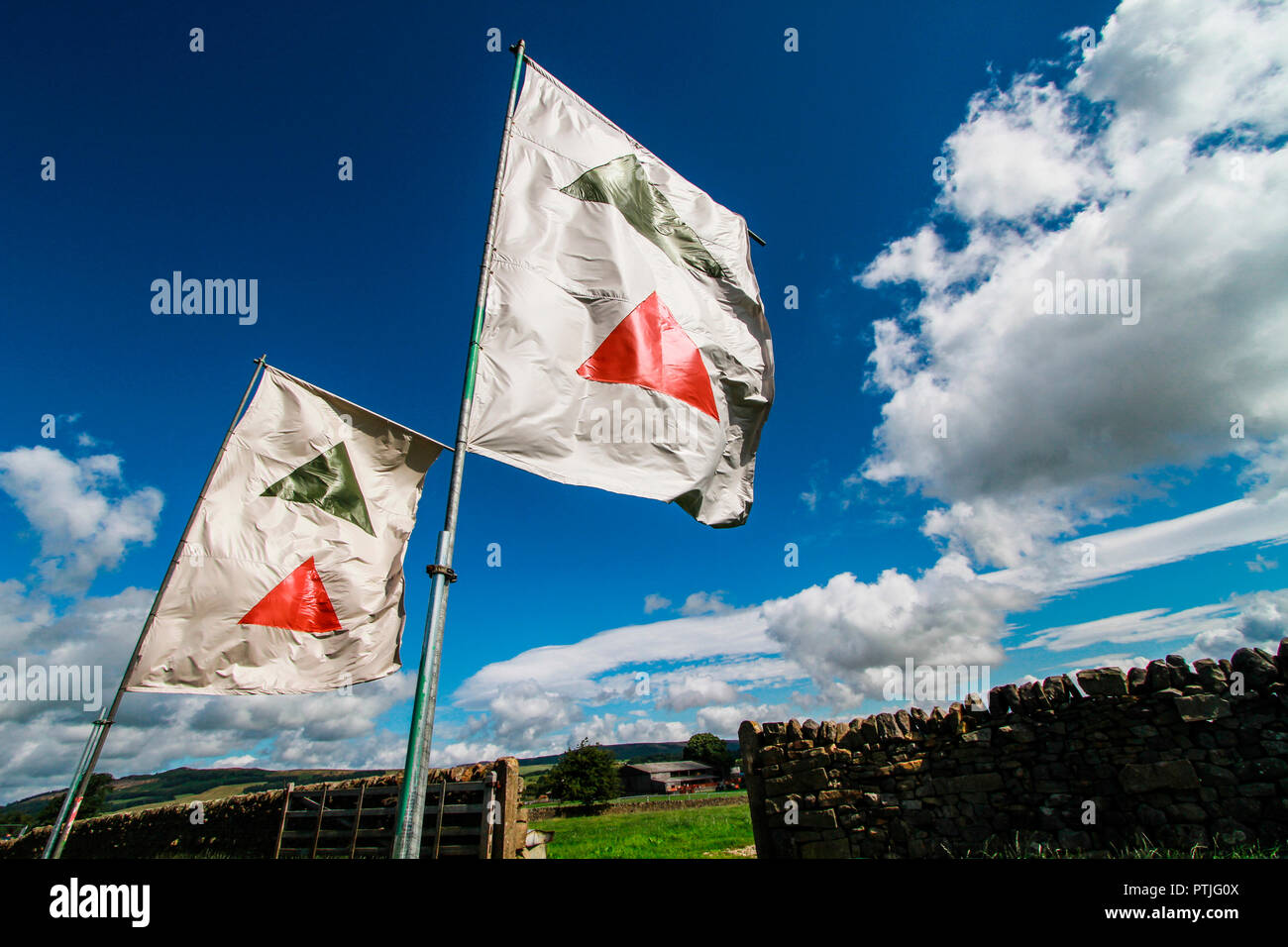 Flags standing at the entrance gate Stock Photo - Alamy
