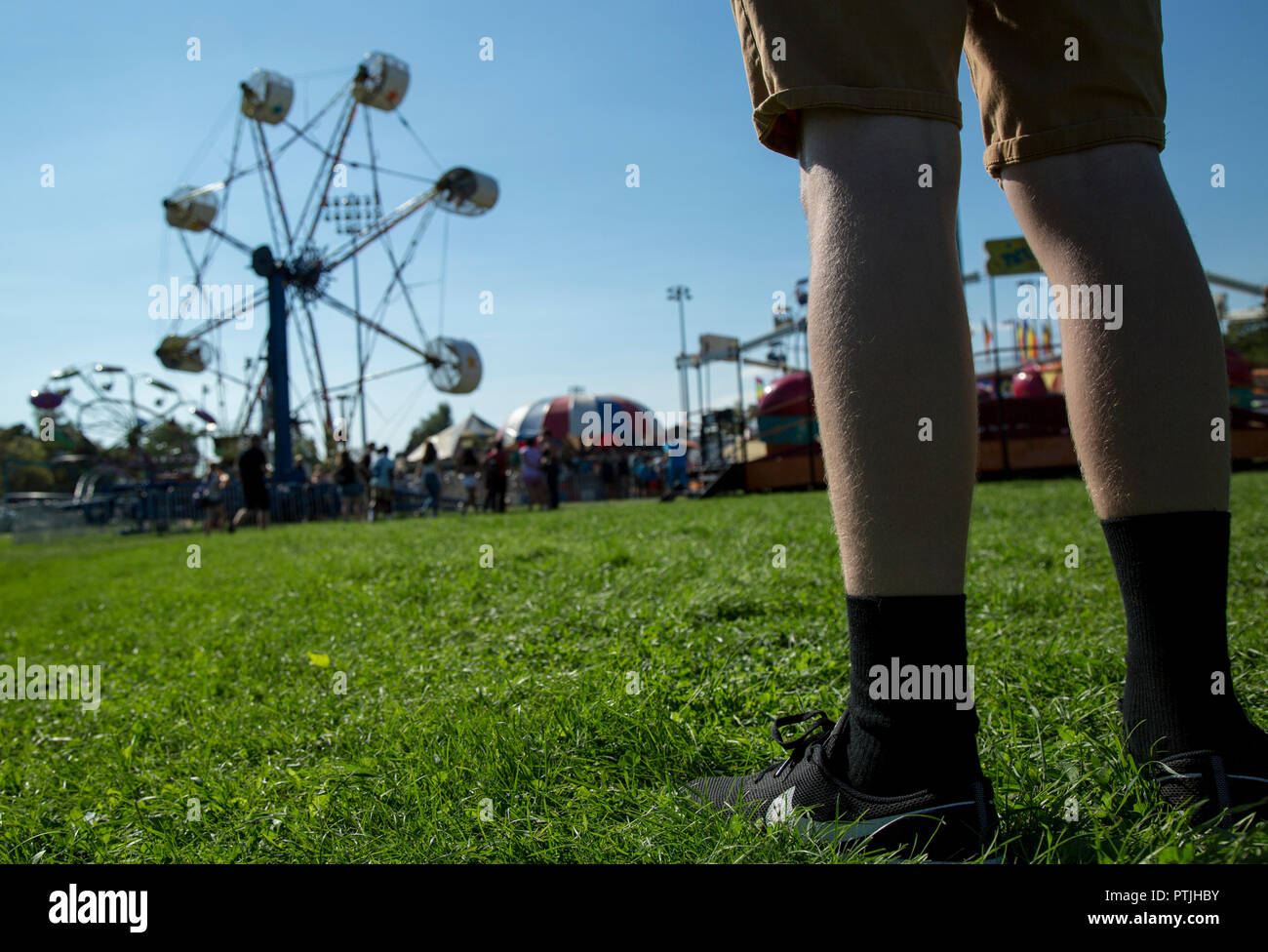 Ground view looking towards the amusement area of a small town fair ...