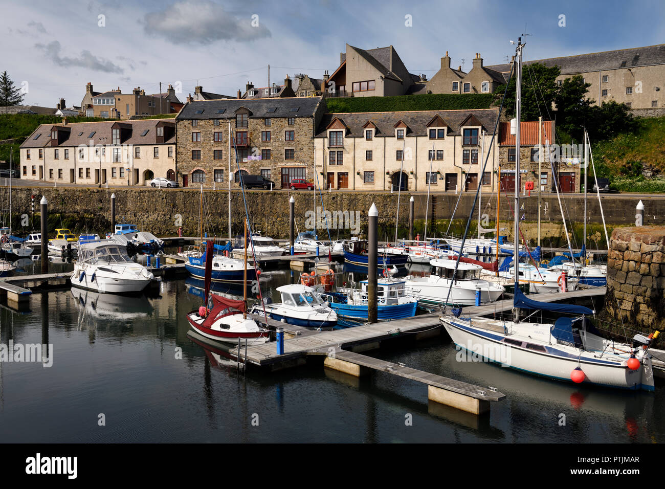 Boats and sailboats docked at Banff Harbour marina on Banff Bay ...