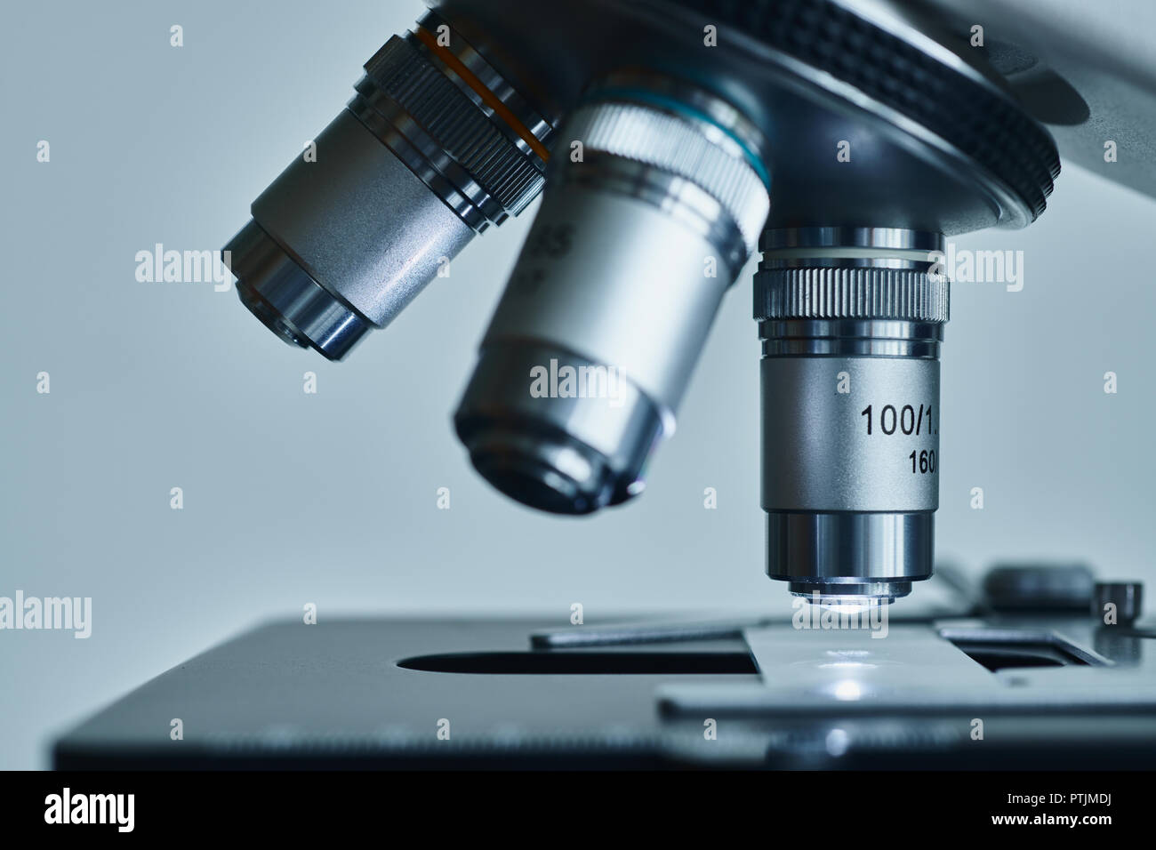 Modern microscope with metal lens at laboratory Stock Photo - Alamy