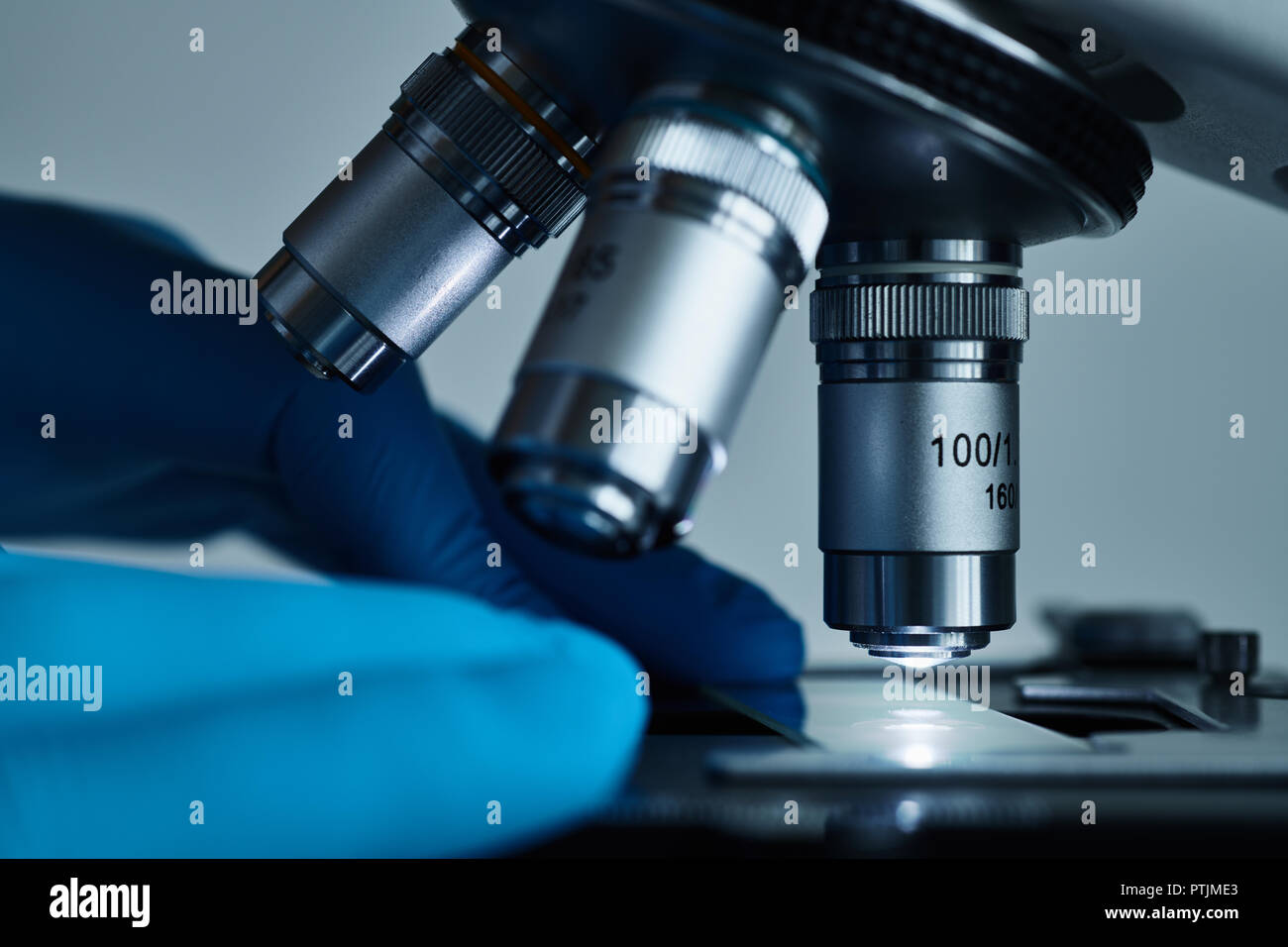 Scientist hands with microscope Stock Photo - Alamy