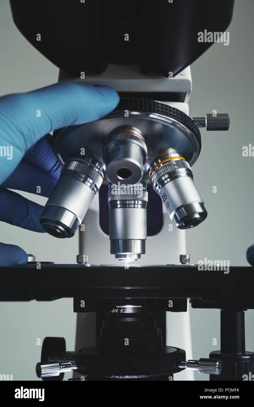 Scientist hands with microscope Stock Photo - Alamy