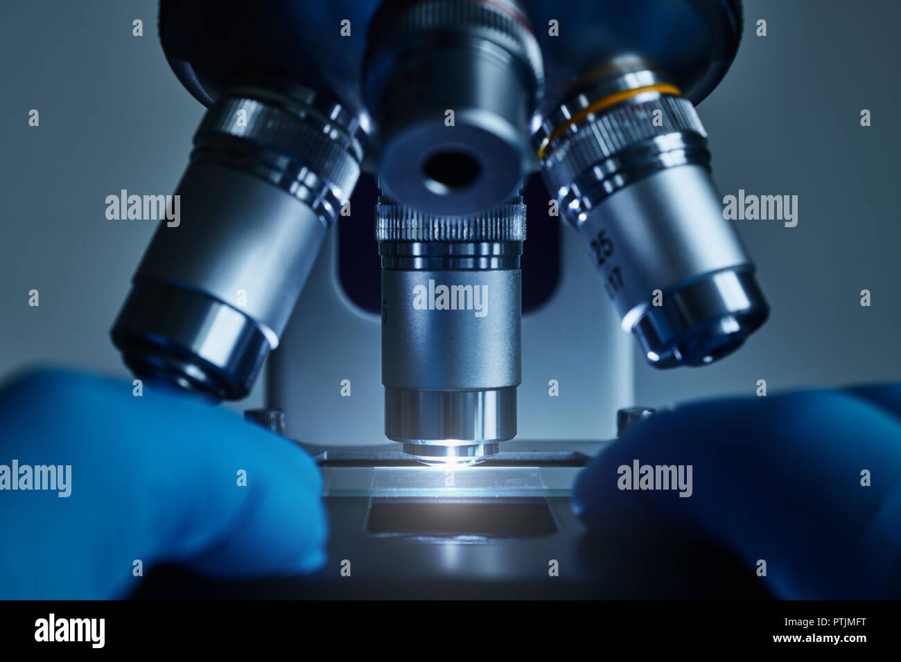 Scientist hands with microscope Stock Photo - Alamy