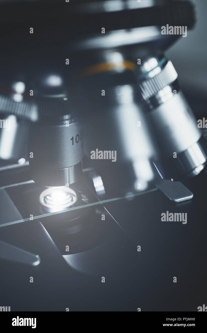 Modern microscope with metal lens at laboratory Stock Photo - Alamy