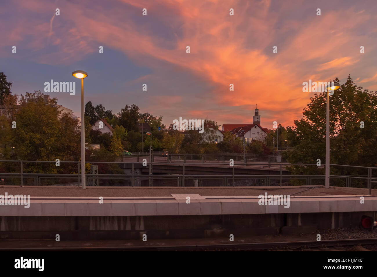 A colorful sunrise above a subway station in Stuttgart Stock Photo - Alamy