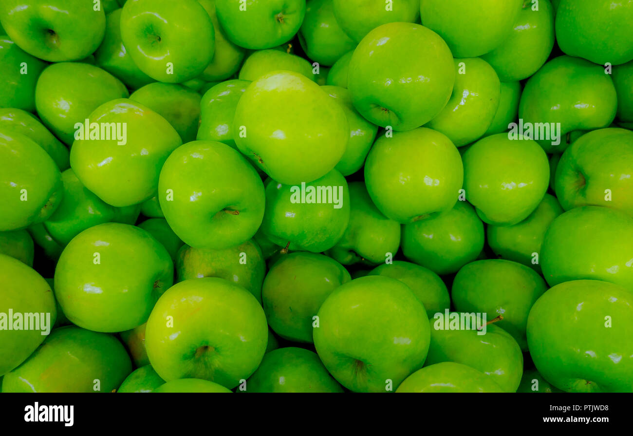 Fresh green apples background. Green apples texture. Fruit in ...