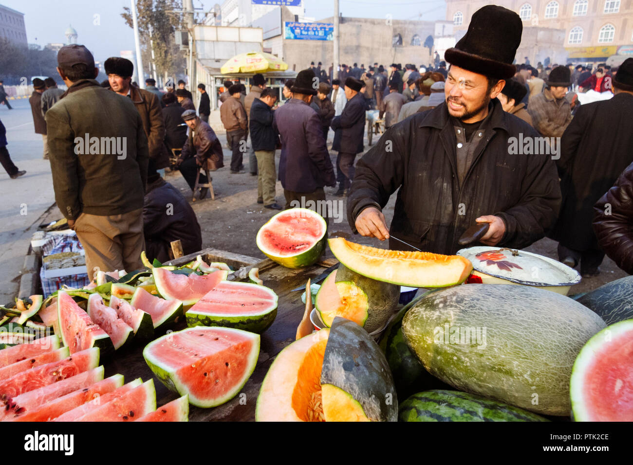 Kashgar, Xinjiang, China : A Uyghur street vendor sells watermelon at ...