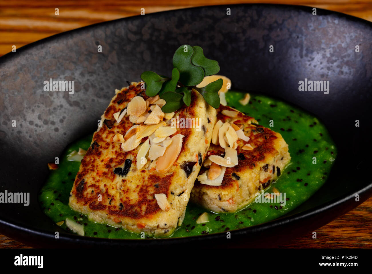 Tofu cutlet with sauce and nuts Stock Photo - Alamy