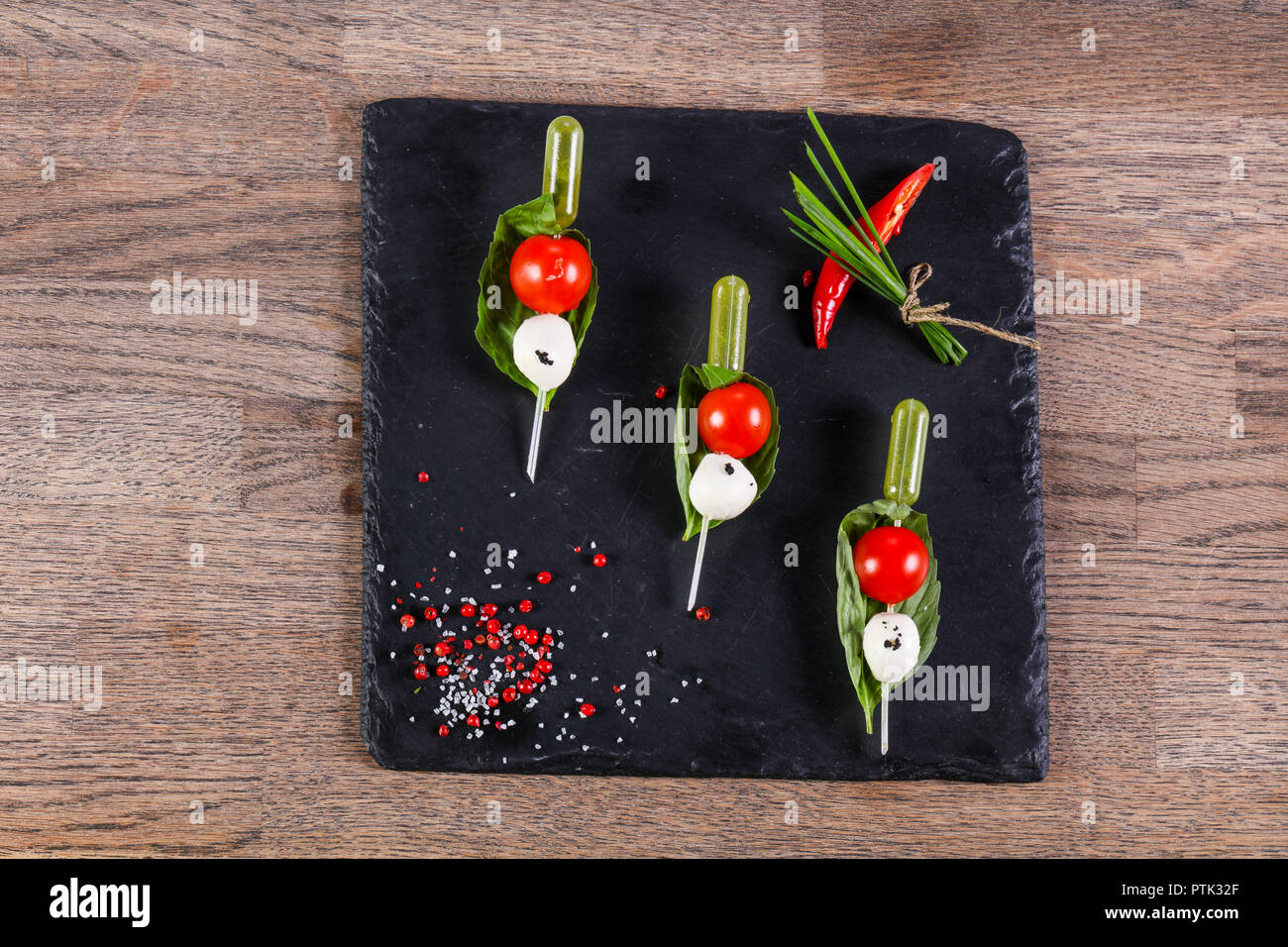 Canape caprese with olive oil Stock Photo - Alamy