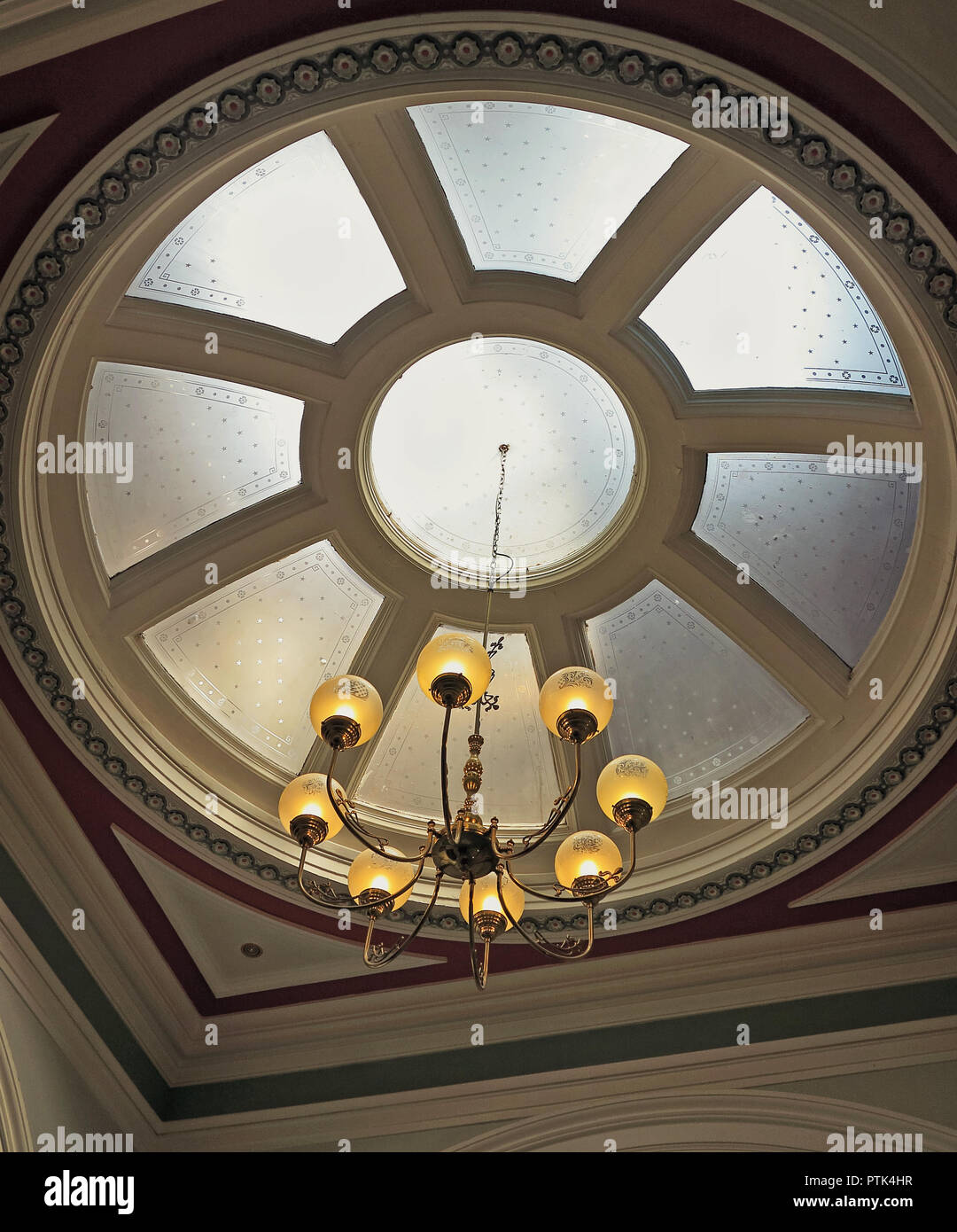 A chandelier hanging under a skylight in Victoria Hall, Saltaire ...